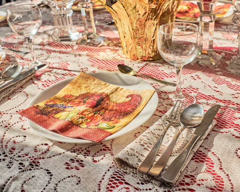 Table Prepared for Thanksgiving Dinner with Silverware and Napkins ...