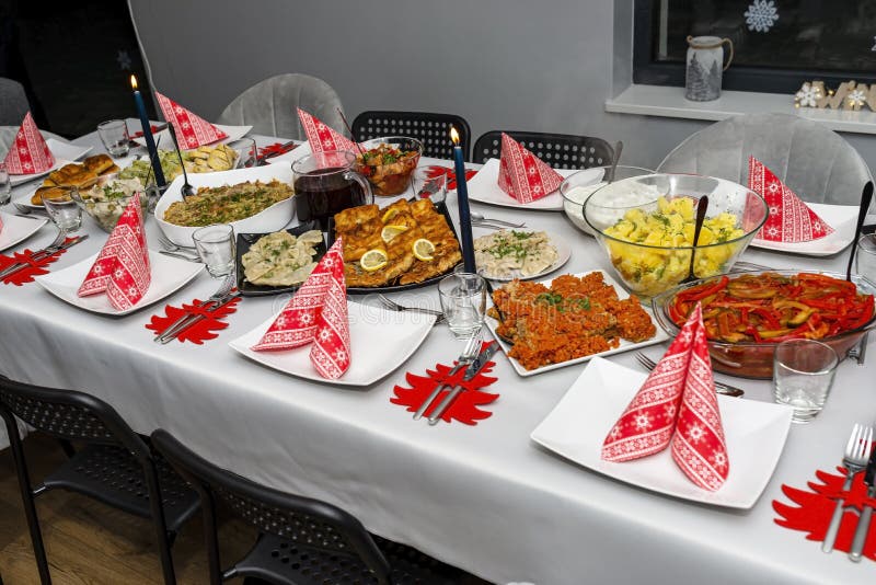 A Table Set before Christmas Dinner with Many Traditional Polish Dishes ...