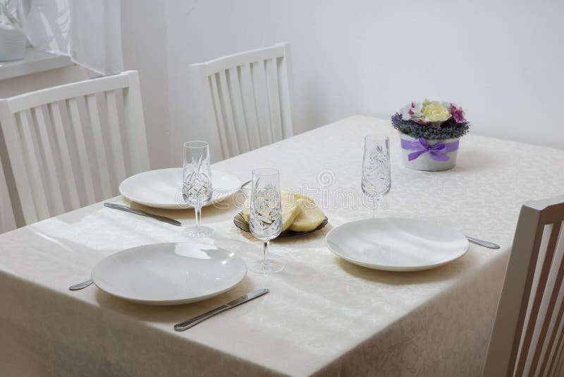 A Table Set for Lunch. Plates on a White Tablecloth Stock Photo - Image ...