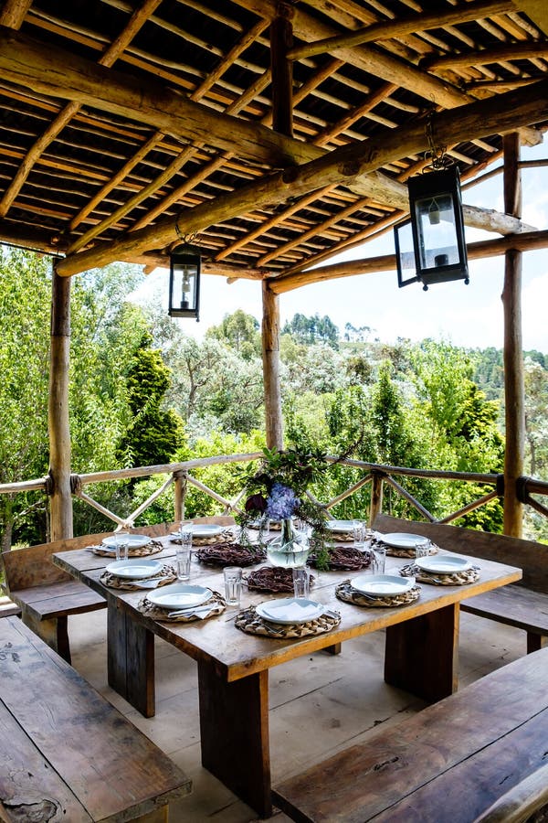 Table Set in an Outside Hut with Beatiful Views To the Forest Stock ...