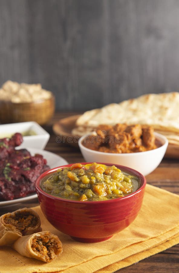 Table Set with Vegetable Curry and Side Dishes on a Wooden Table Stock ...