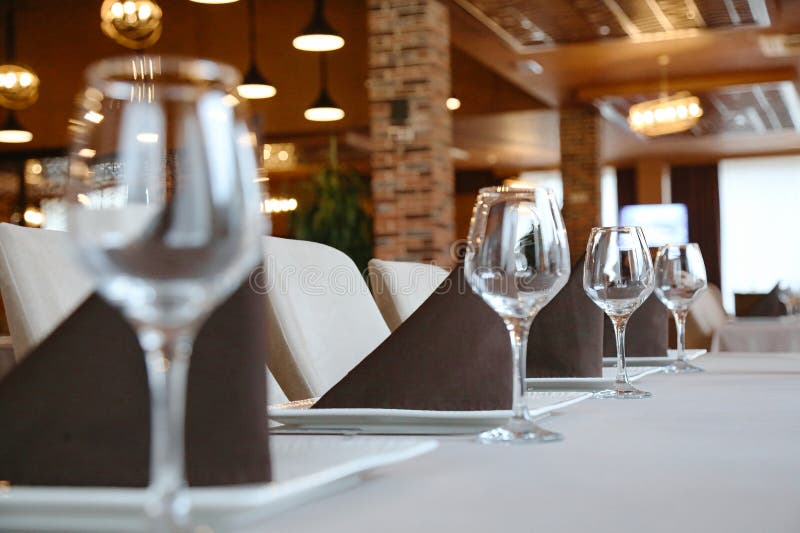 Table Set with Wine Glasses and Plates for a Formal Dinner Stock Image ...