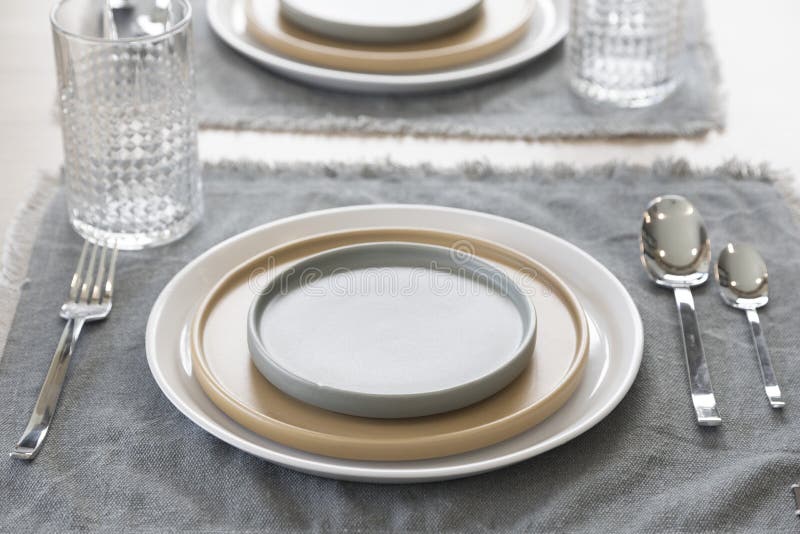 Table Set on Table with Yellow Plate Setting in Modern Style Dining ...