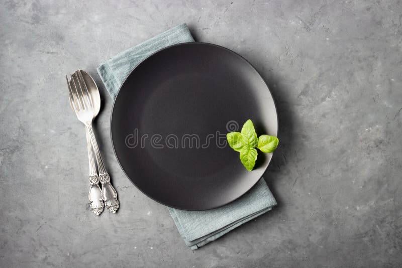 Table Setting. Black Plate, Cutlery and Napkin Stock Image - Image of ...