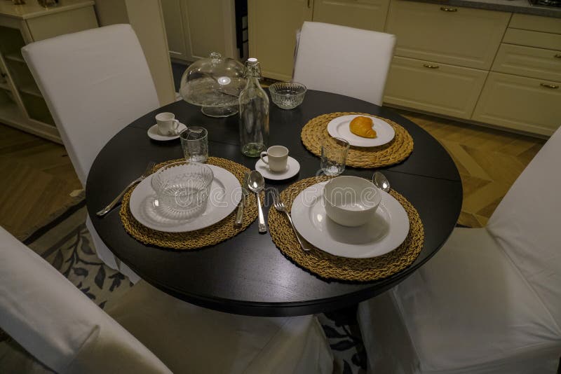 Table Setting for Breakfast in Kitchen. Black Round Table with Plates ...
