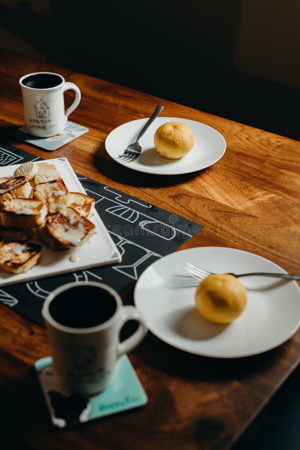 Table Setting for Breakfast - Plate, Fork, Cup and Toast on the Wooden ...