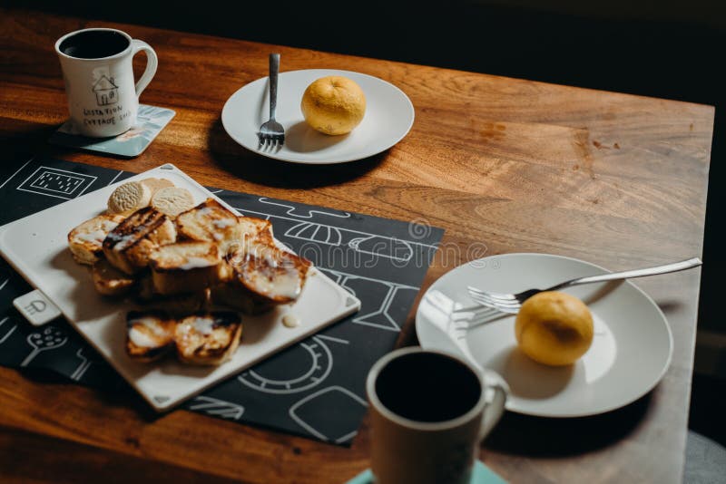 Table Setting for Breakfast - Plate, Fork, Cup and Toast on the Wooden ...