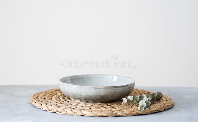Table Setting with Ceramic Plate and Eucalyptus Branches on Blue ...