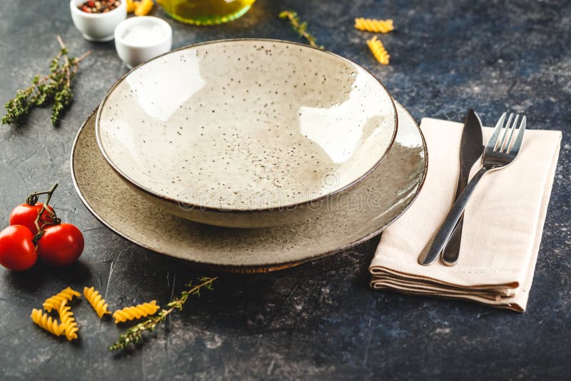 Table Setting with Cutlery, Pasta, Tomatoes and Herbs Stock Image ...