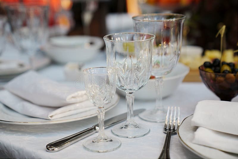 Table Setting for a Festive Dinner. Empty Wine Glasses, Tableware and ...