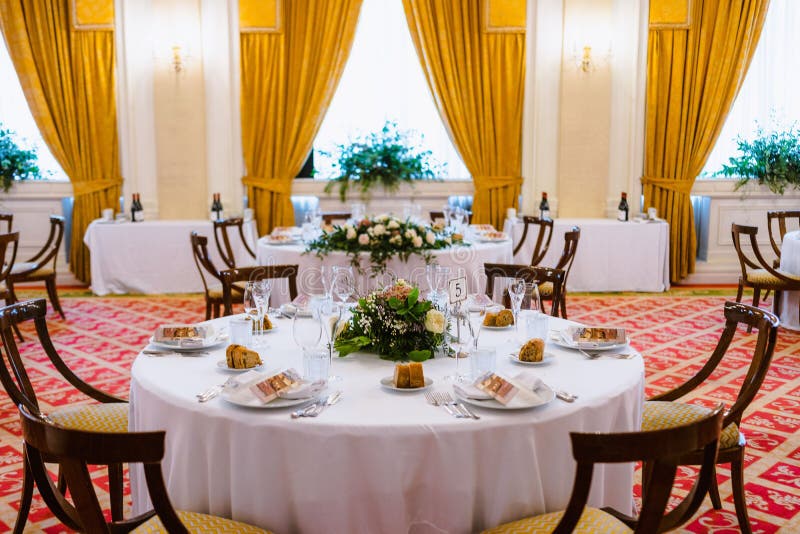 Table Setting with Flower Arrangement in the Center at a Wedding ...
