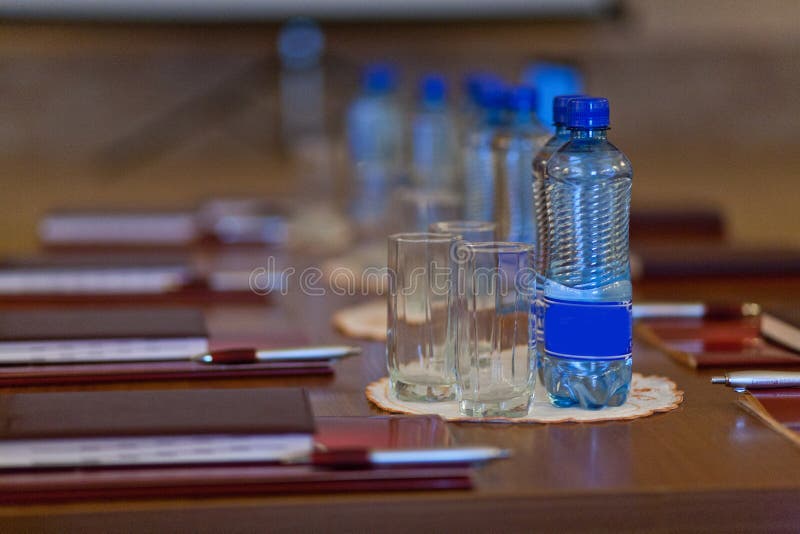 Table Setting for Meetings. Mineral Water, Folder, Pen. Stock Photo ...