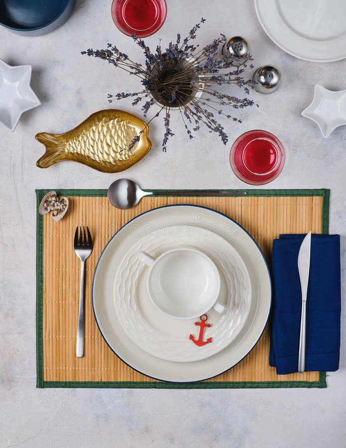 Table Setting for One Person in a Marine Style on a Light Concrete ...