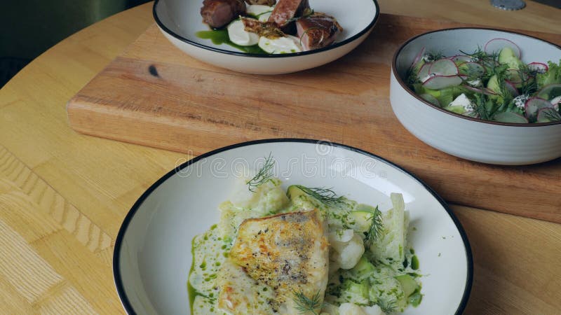 Table Setting. Ready-made Dishes, Meat, Fish and Vegetable Salad on the ...