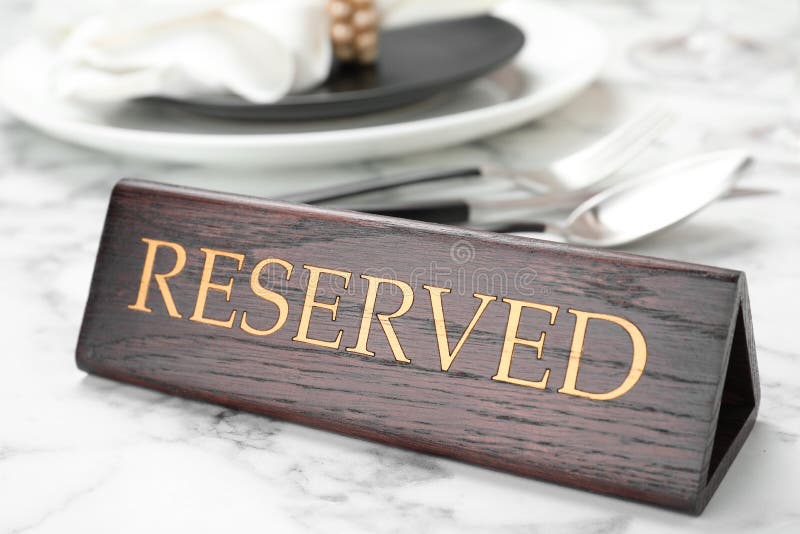 Table Setting with RESERVED Sign in Restaurant Stock Photo - Image of ...