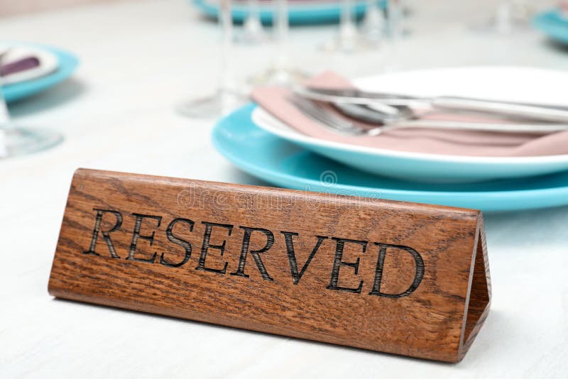 Table Setting with RESERVED Sign in Restaurant Stock Image - Image of ...