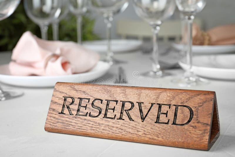 Table Setting with RESERVED Sign in Restaurant Stock Image - Image of ...