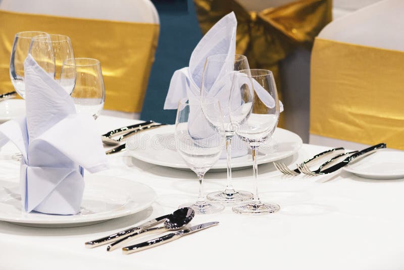 Table Setting in the Restaurant, Water in the Grass on the Dining Table ...