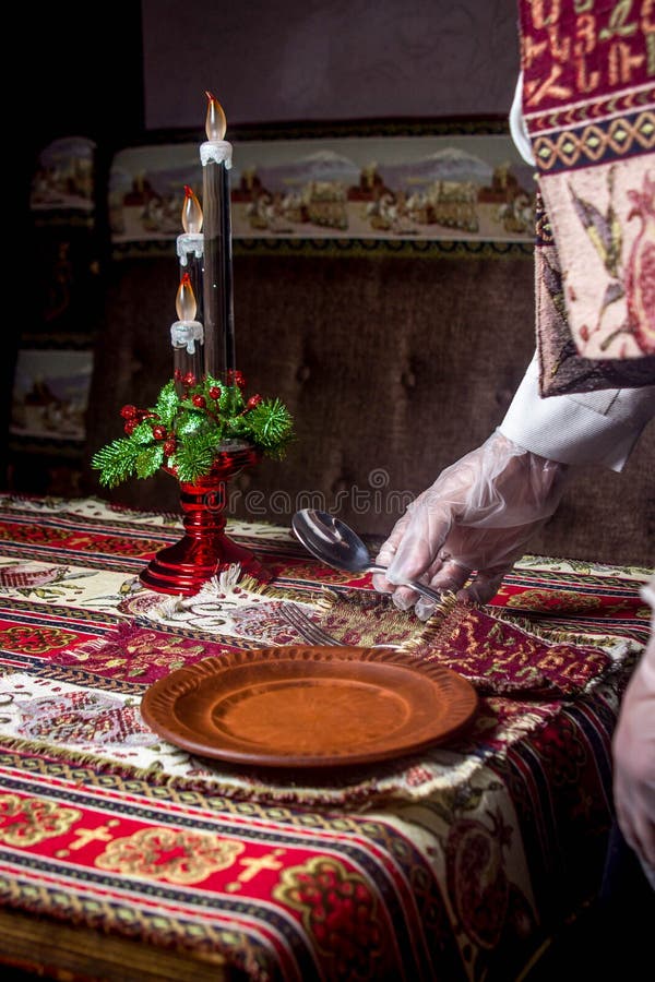 Table Setting. the Waiter Puts a Spoon Next To a Plate on the Table ...