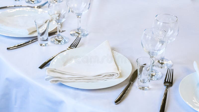 Table Setting - White Napkin, Plates, Glasses, Knives and Forks Stock ...