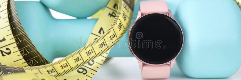 On Table are Smart Watch Dumbbell Centimeter. Stock Image - Image of ...