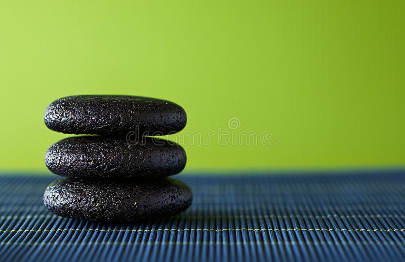 Table with Smooth Black Rocks and Bamboo Branches Stock Image - Image ...