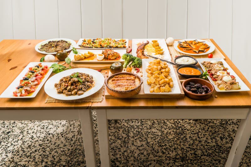 Table with Tapas and Typical Spanish Food. Stock Photo - Image of baked ...