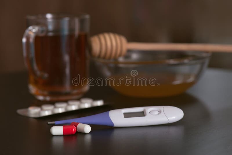On the Table are Tea, Thermometer, Tablets and Honey Stock Photo ...