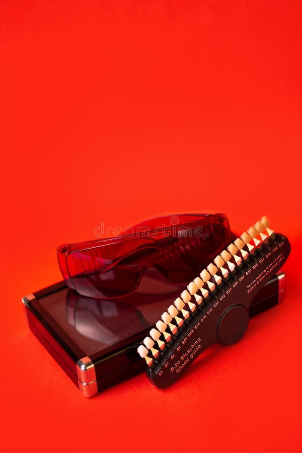 Table of Teeth Color. Scale on a Red Background Close-up Stock Image ...