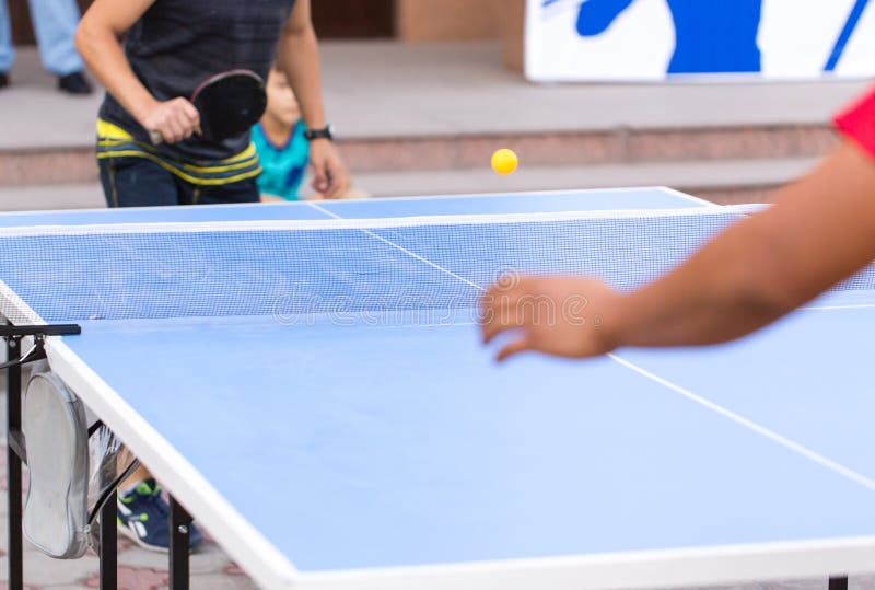 Table Tennis Game with a Blue Table Stock Image - Image of black, match ...