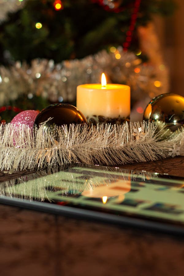 On the Table There is a Candle and a Tablet Stock Image - Image of year ...