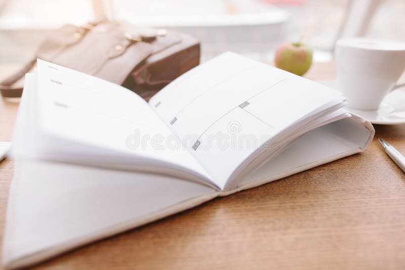 On the Table There is a Diary, a Bag, a Pen and a Cup of Coffee Stock ...
