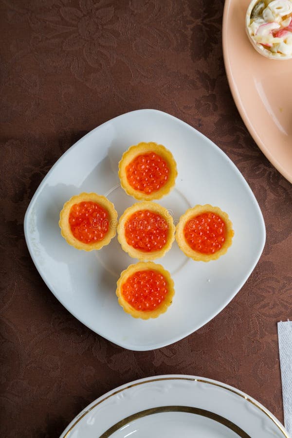 On the Table There is Red Caviar in Tartlets and Other Snacks Stock ...