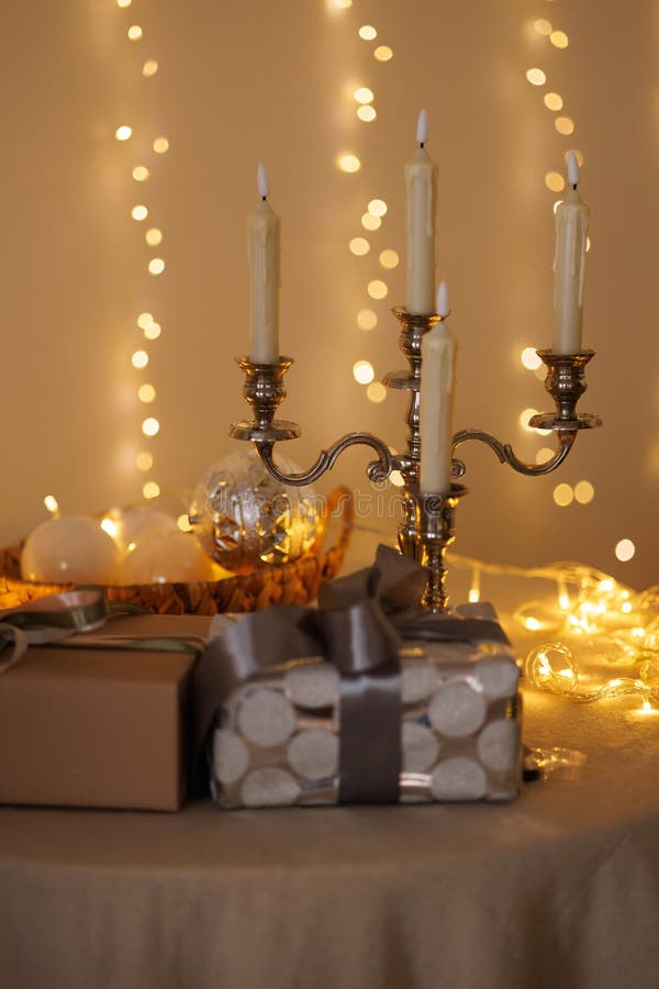 A Table with Three Candles and Two Gift Boxes Stock Image - Image of ...