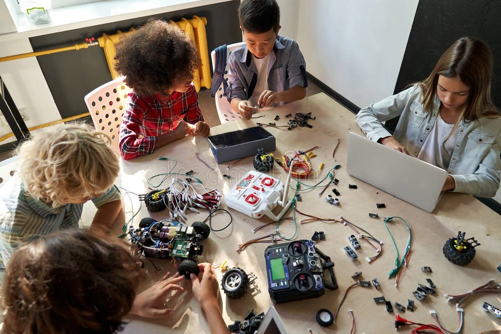 Group of Multiracial Schoolkids at Stem Class Building Robot. Table Top ...