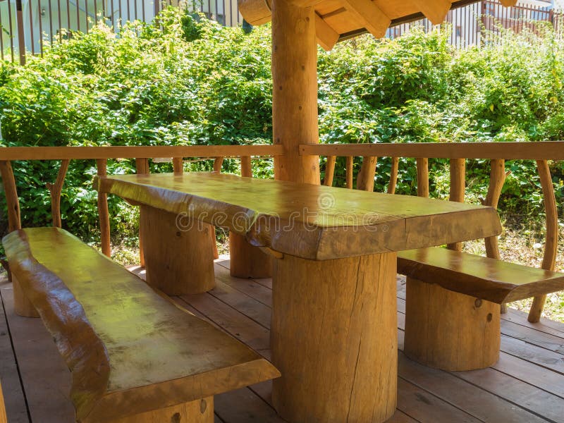 A Table and Two Benches Made of Large Solid Wood in Log Cabin Stock ...