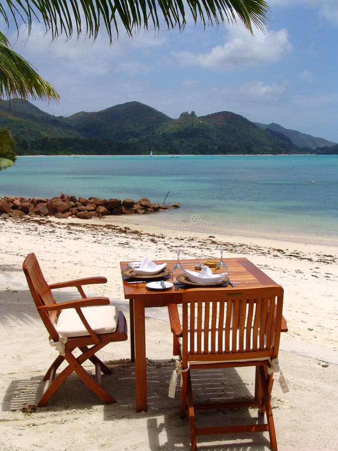 Dining table on beach stock image. Image of elegant, couples - 26008143