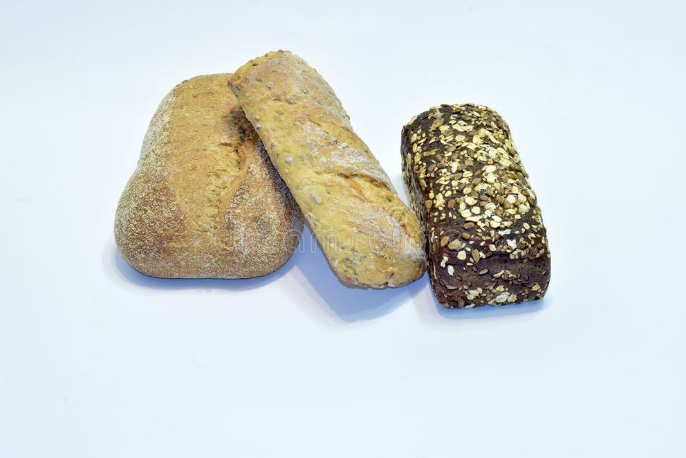 On the Table are Two Wheat Breads and a Rye Brick Stock Photo - Image ...