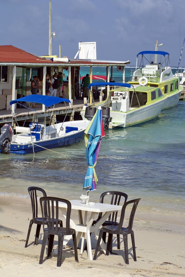 Table with an Umbrella on the Beach on Ambergris Key Editorial Stock ...
