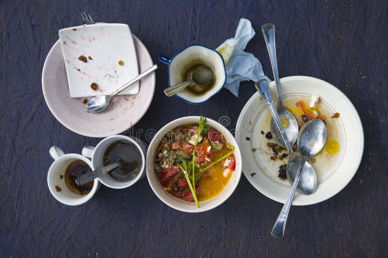Table with untidy dishes stock photo. Image of vegetables - 181481374