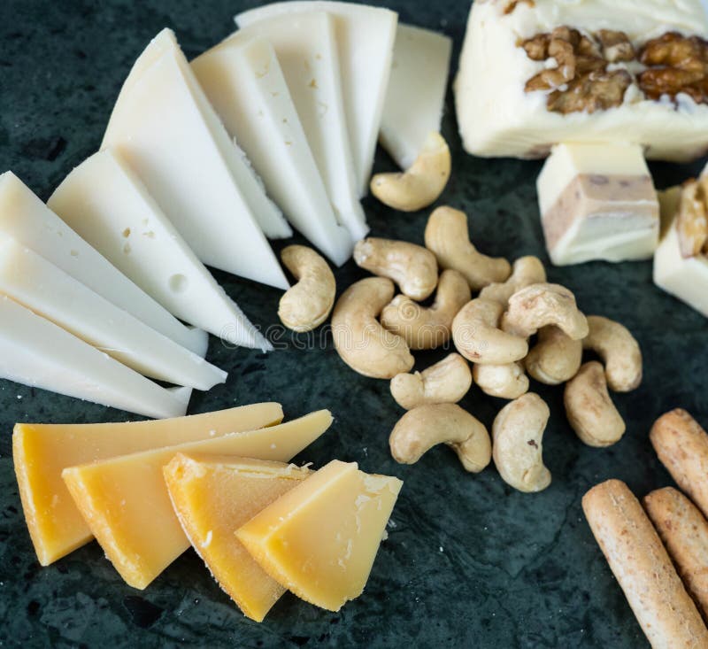 Table with Varieties of Ripened and Soft Cheeses Stock Photo - Image of ...