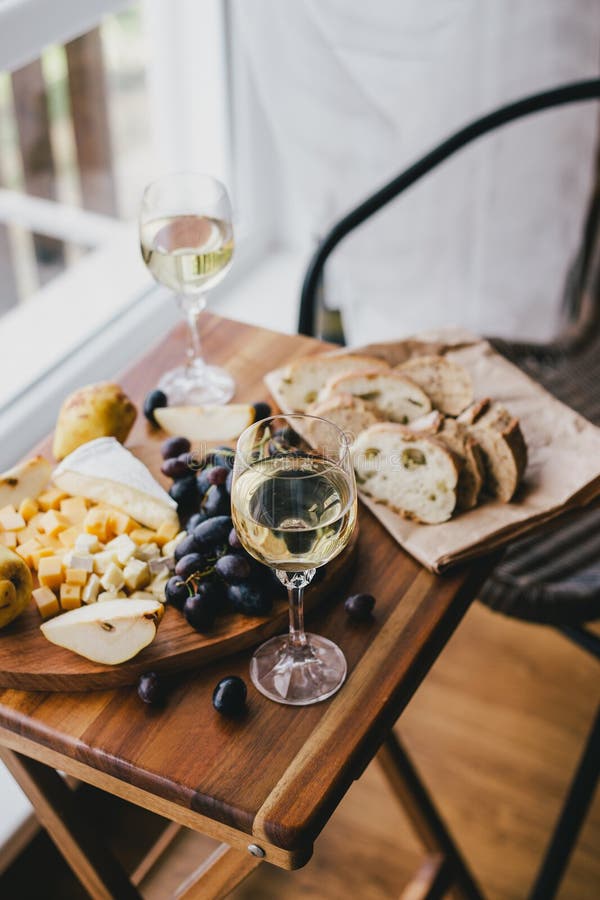 Table with Wine, Cheese, Bread, Grapes and Pears Stock Image - Image of ...