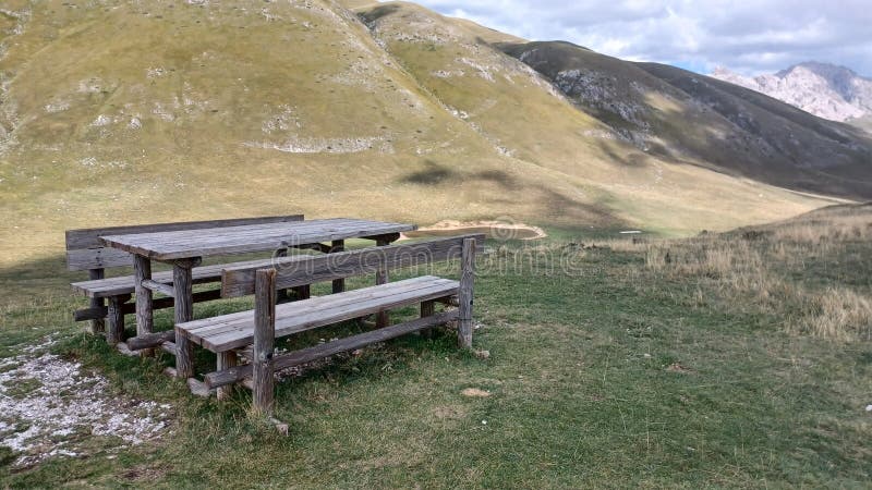 Table with Wooden Benches for a Quiet Picnic in the Mountains Stock ...