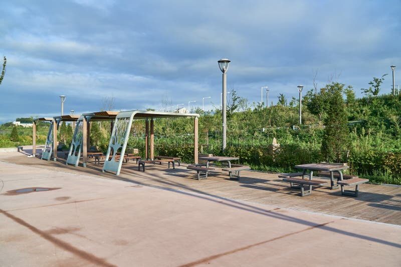 Tables and Benches in a Park Stock Photo - Image of white, trees: 134823892