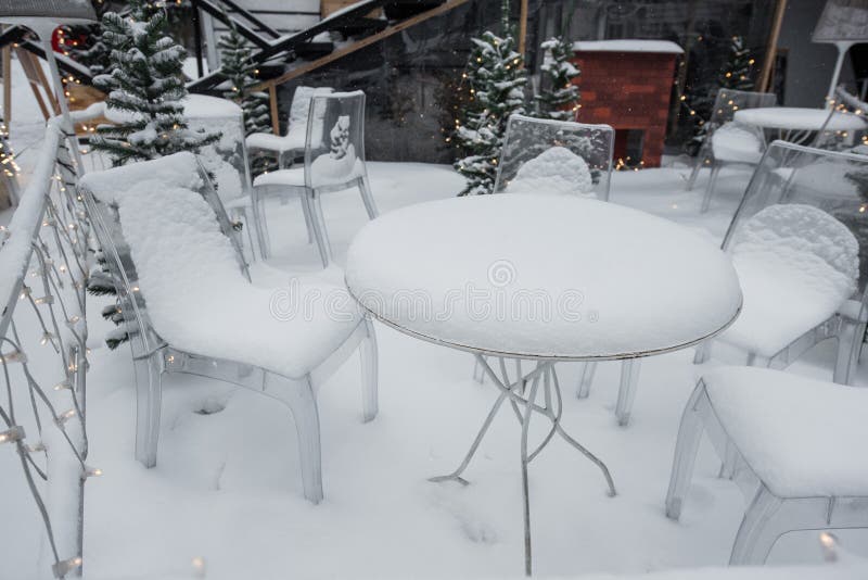 Tables and Chairs in a Cafe Covered with Snow Outdoors. Stock Image ...
