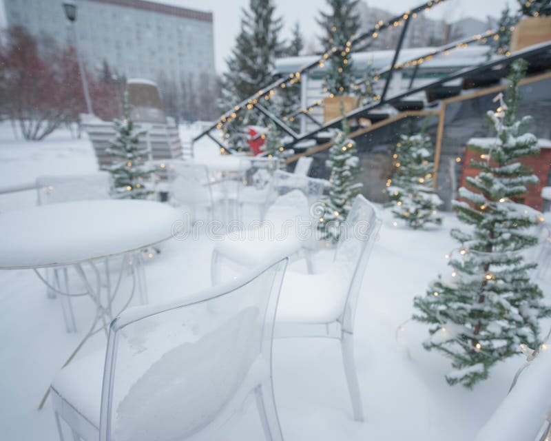 Tables and Chairs in a Cafe Covered with Snow Outdoors. Stock Photo ...