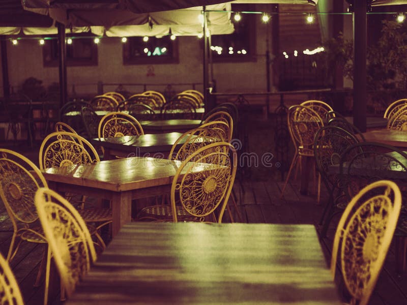 Tables and Chairs in Cafe at Night Stock Image - Image of lounge ...