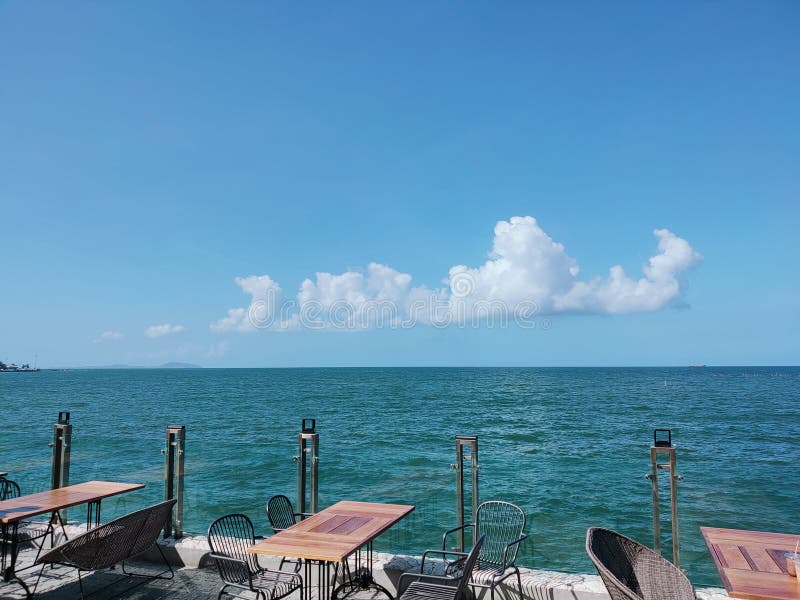 Tables and Chairs for Dining in the Seaside and Sky Atmosphere. Stock ...