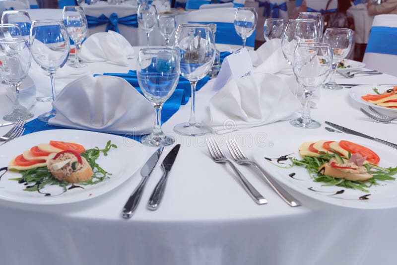 Tables and Chairs in the Restaurant with Food and Full Set Preparation ...