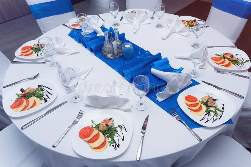 Tables and Chairs in the Restaurant with Food and Full Set Preparation ...